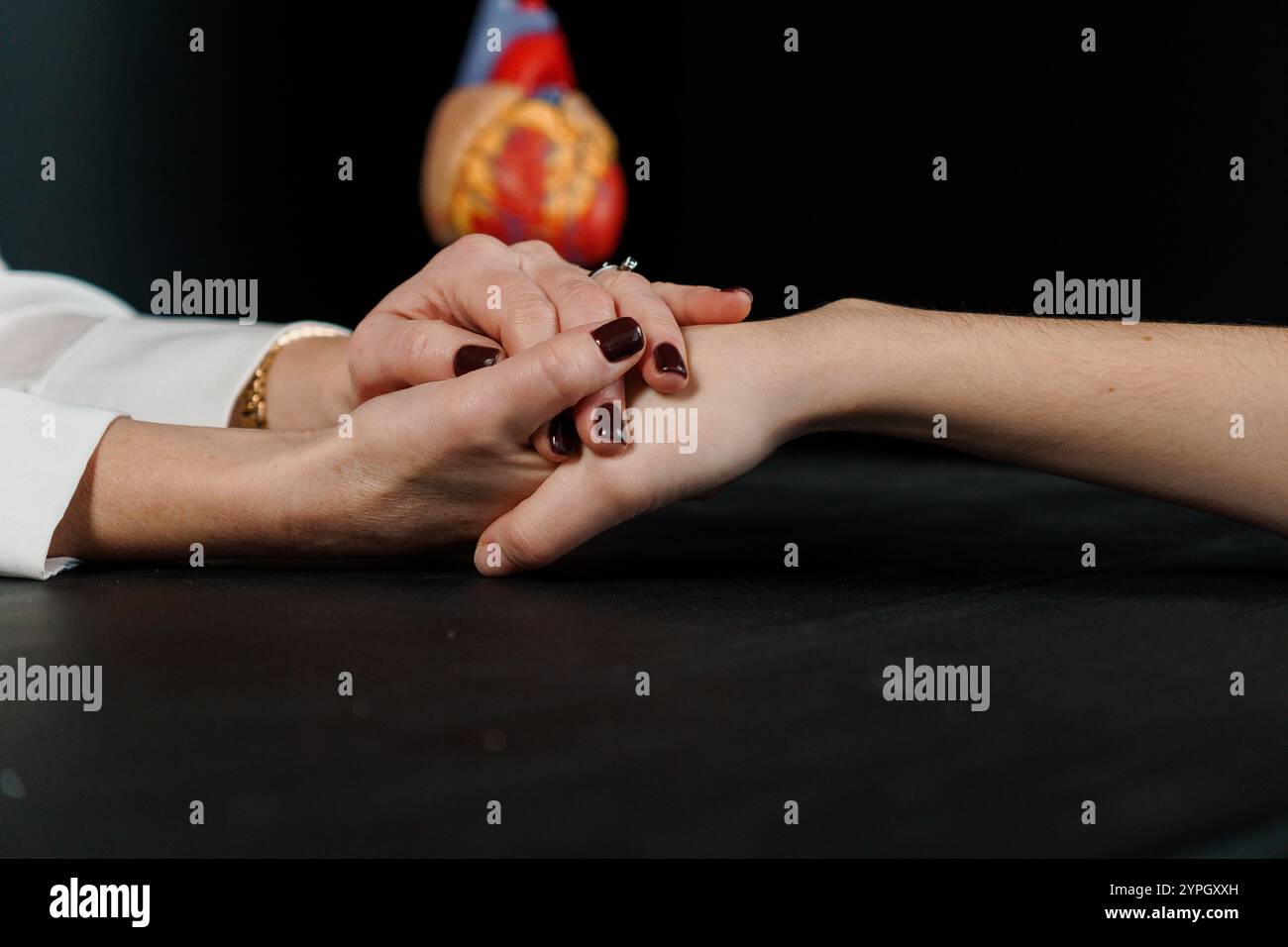 Touching Moment of Connection With Heart Model in Background Stock ...