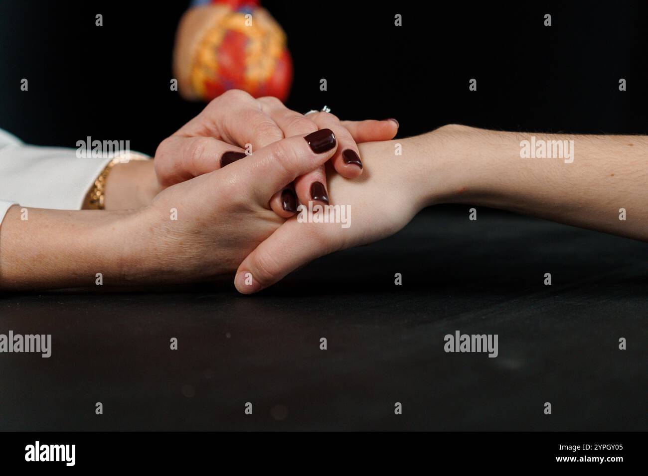 Hands of Connection: An Intimate Moment between Patients and Caregivers ...