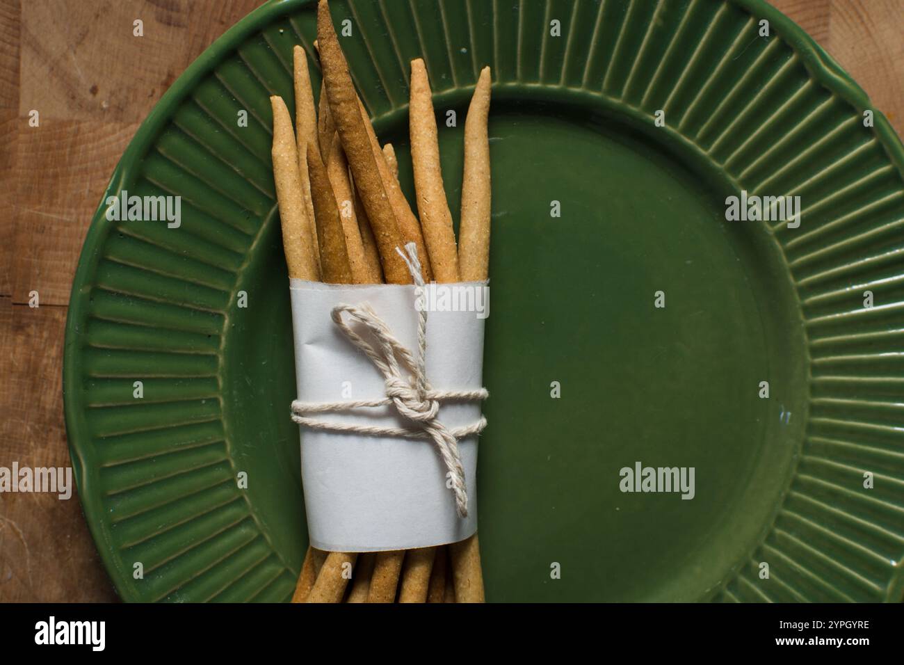 Top view of fried corn stick snack on a green plate, Overhead view of ...