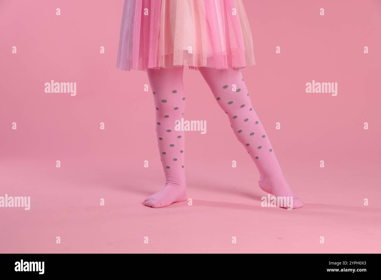 Child wearing tights on pink background, closeup Stock Photo - Alamy