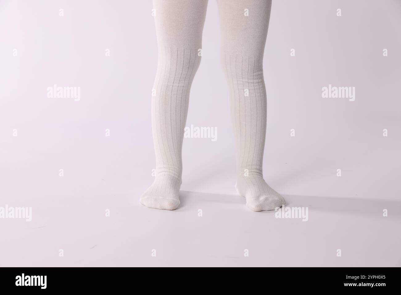 Child wearing tights on white background, closeup Stock Photo - Alamy
