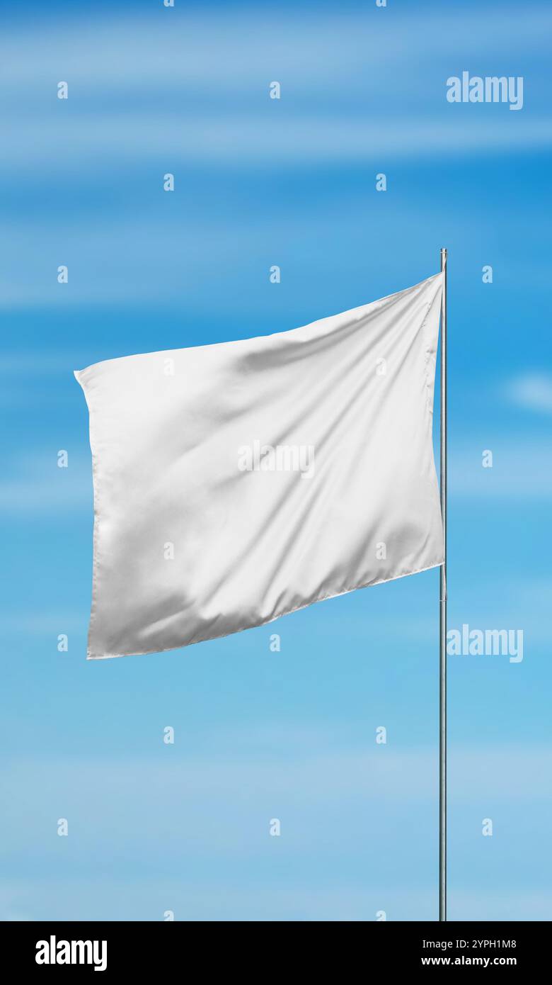 White blank flag against a clear sky, vertical composition, perfect for ...