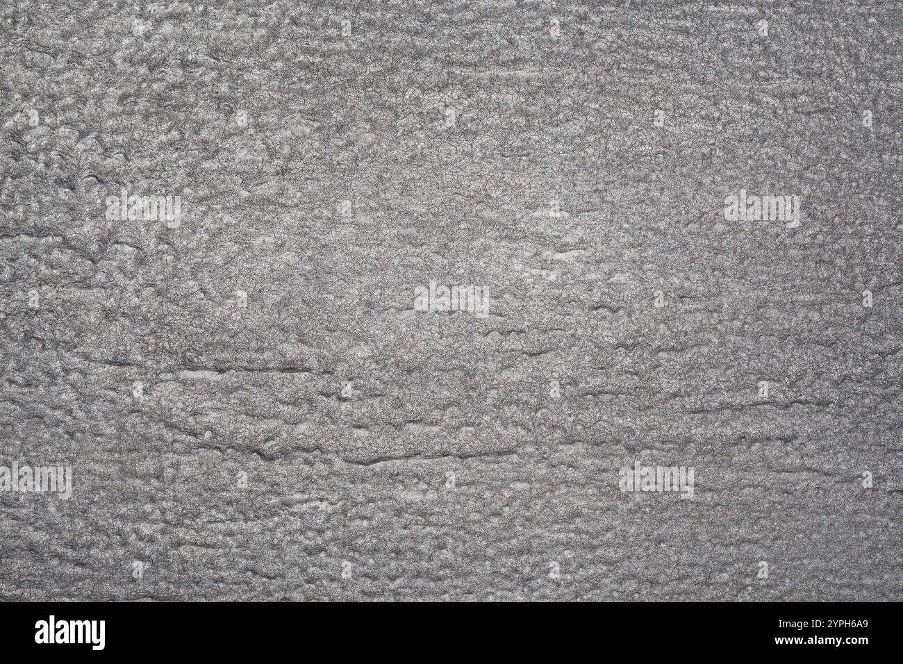 Surface painted with silver paint with streaks and microcracks from age ...