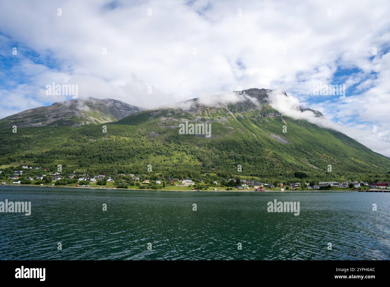 Green mountains, fjord and blue sky in Norwegian landscape in ...