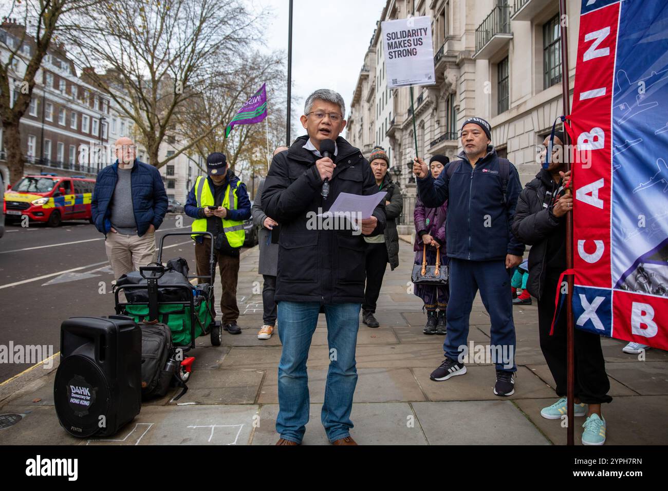 London, UK, 30th November 2024. An activist gives a speech at a ...
