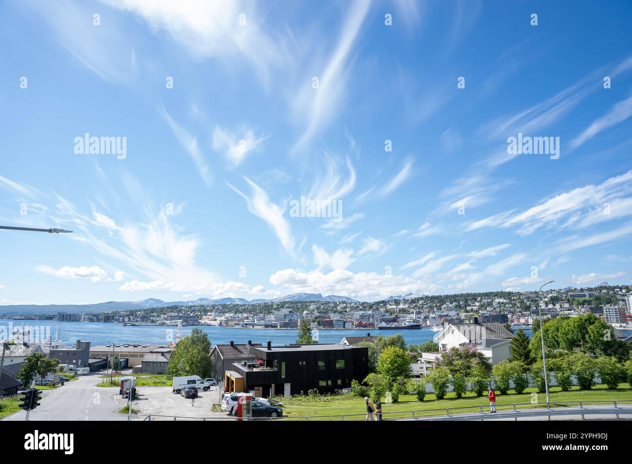 Tromso, Norway - 07.04.2024: Cirrus clouds in blue sky over Tromso ...