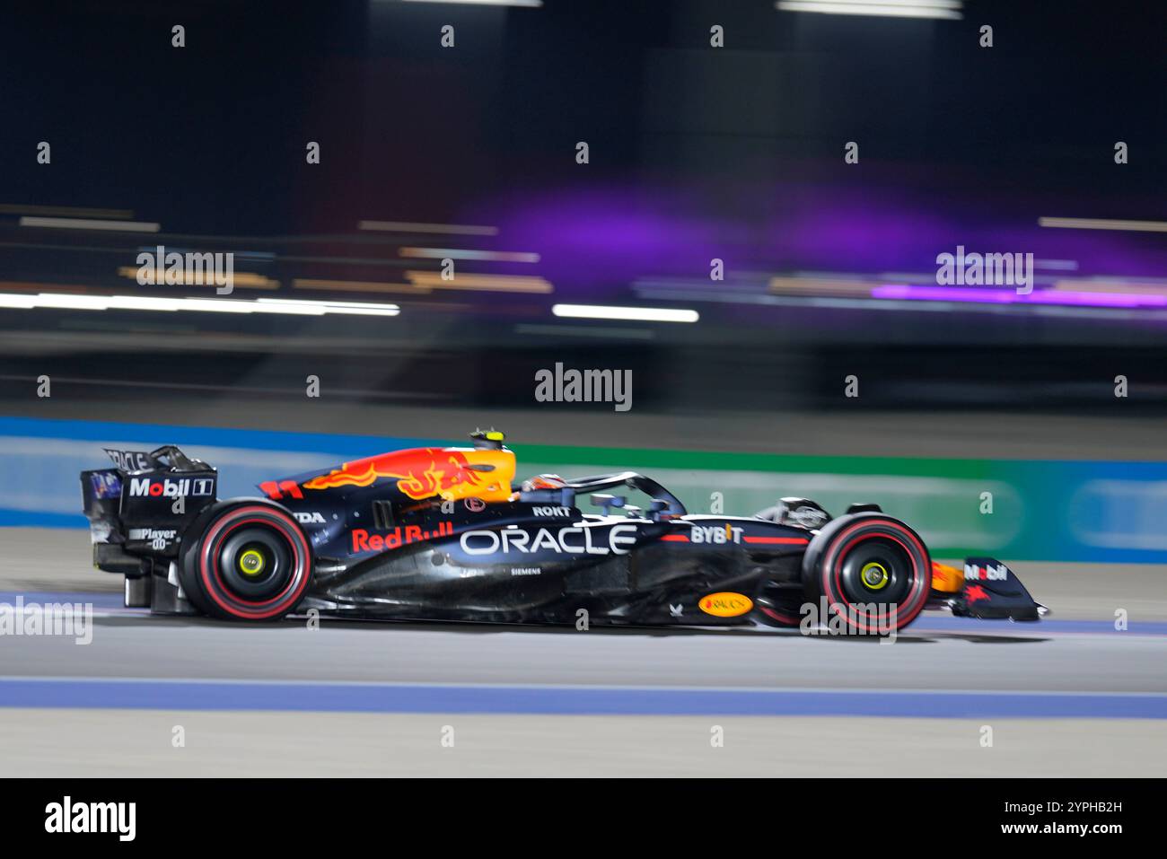 Red Bull driver Sergio Perez of Mexico steers his car during the qualifying race at the Formula ...