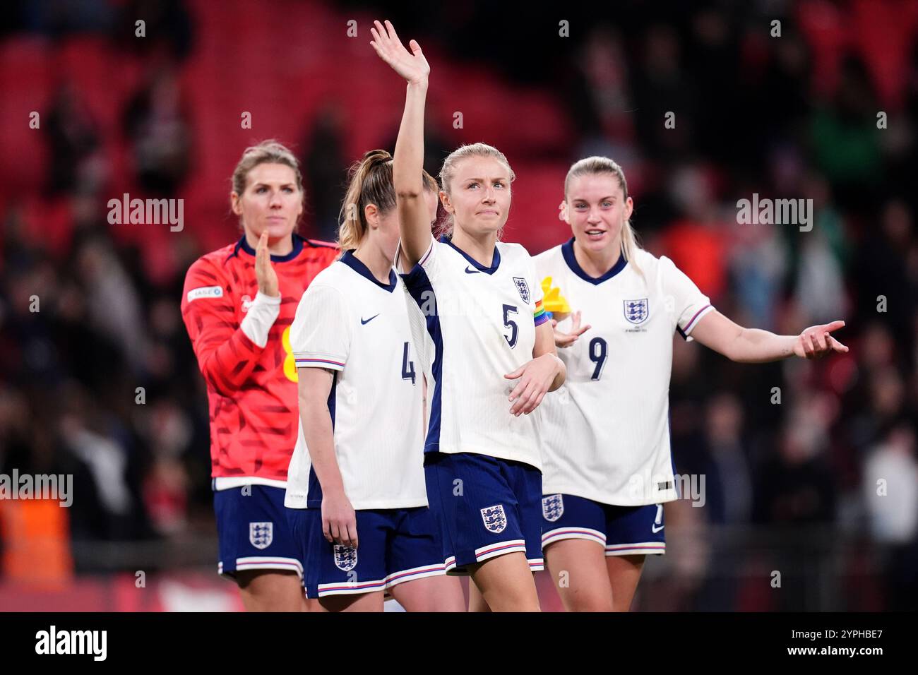 England's Leah Williamson (centre) and team-mates acknowledge the fans ...