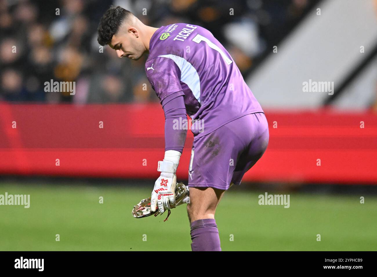 Cambridge, UK. 30th Nov 2024. Goalkeeper Sam Tickle (1 Wigan Athletic ...