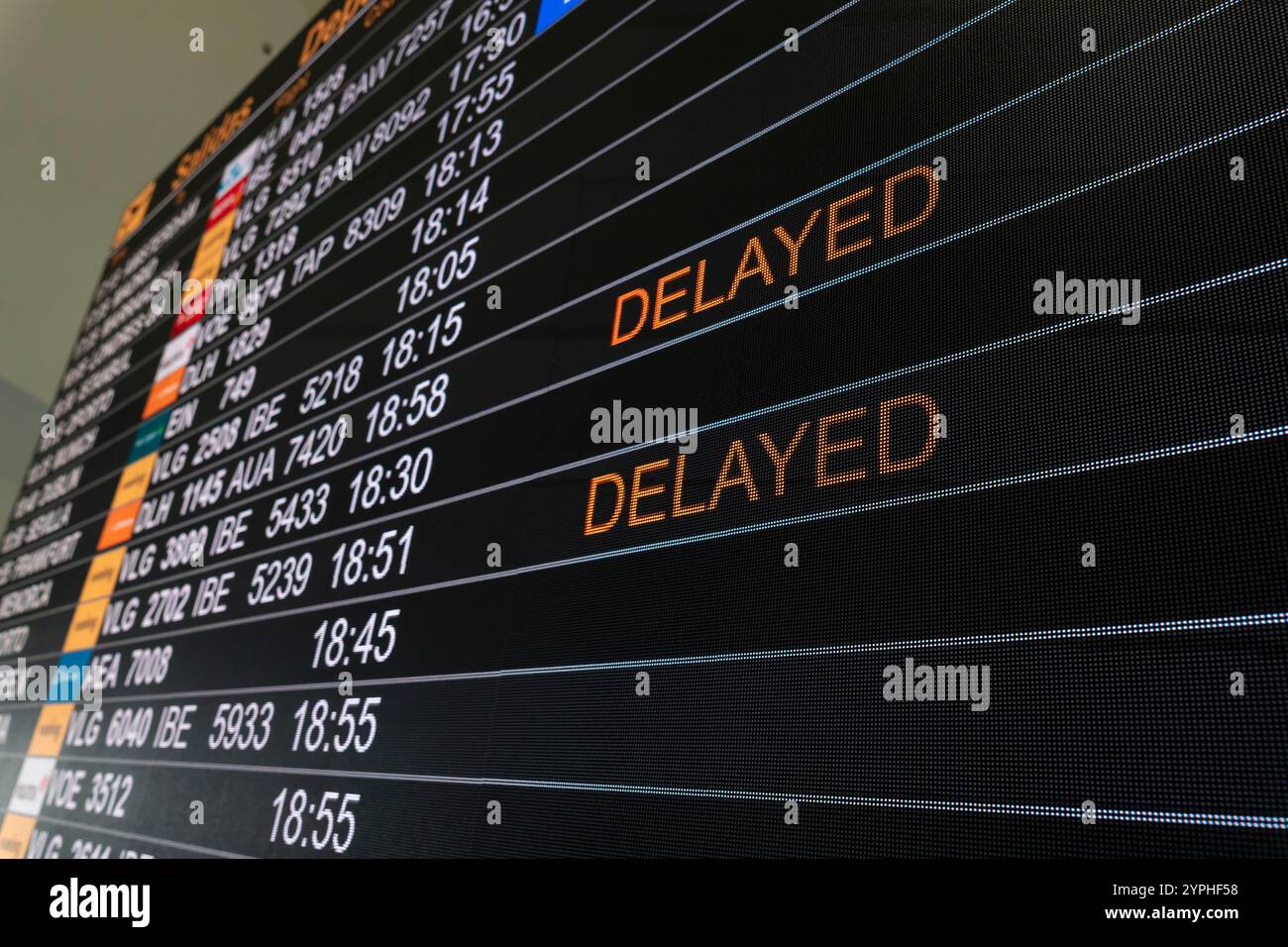 The flight information display highlights delayed flights in English at ...