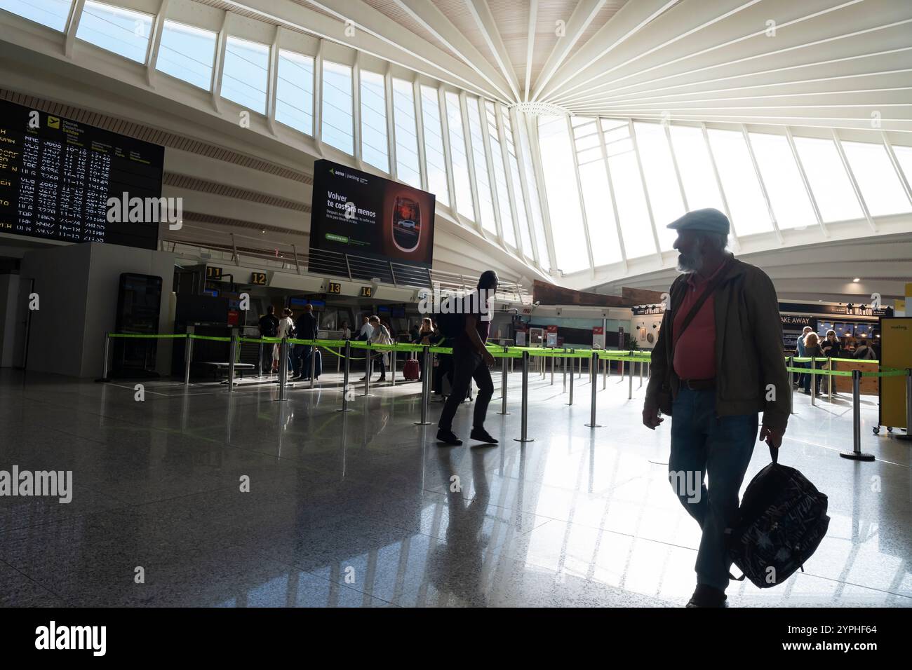 Passengers make their way through the main terminal at Bilbao Airport ...