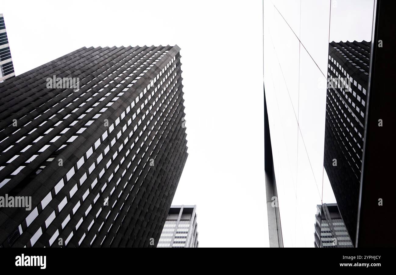 The image presents a striking black and white scene dominated by two ...