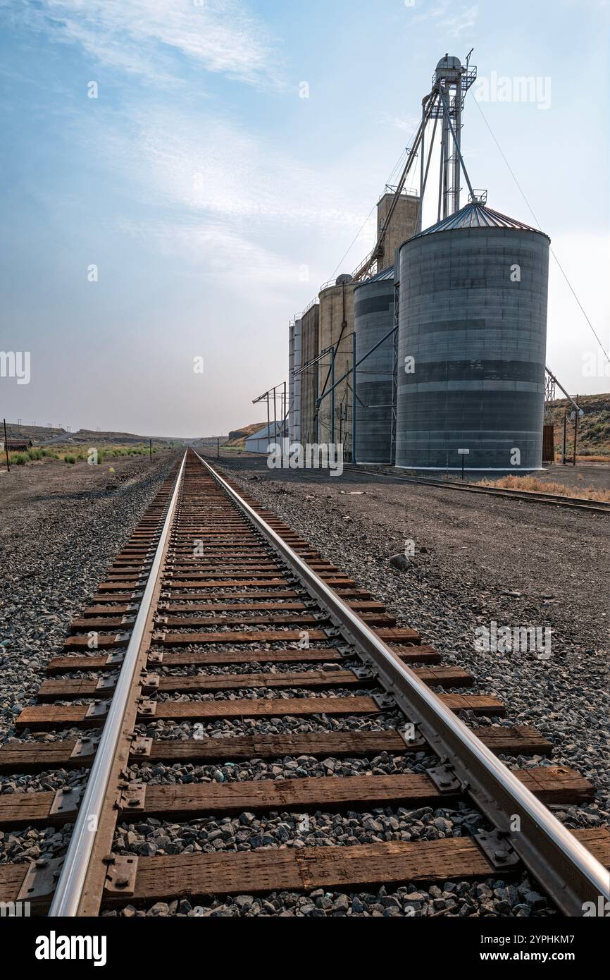 Railroad tracks running along the storage bins of a country grain ...