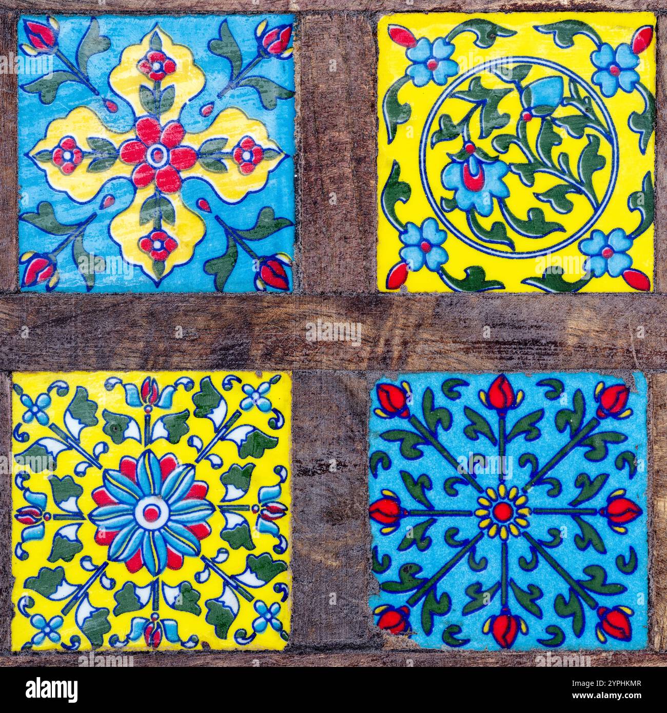 Decorative tiles are inlaid on the top of a wood table Stock Photo - Alamy