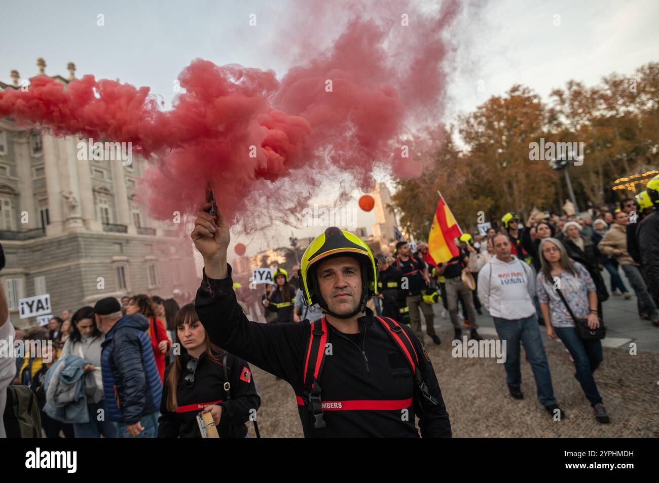Madrid, Spain. 30th Nov, 2024. A firefighter carrying a smoke bomb ...