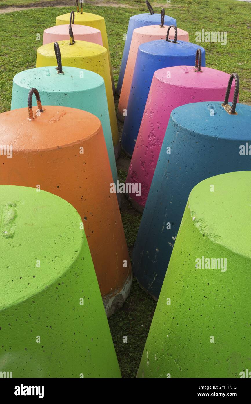 Two rows of fluorescent green, orange, blue, pink, turquoise and yellow ...