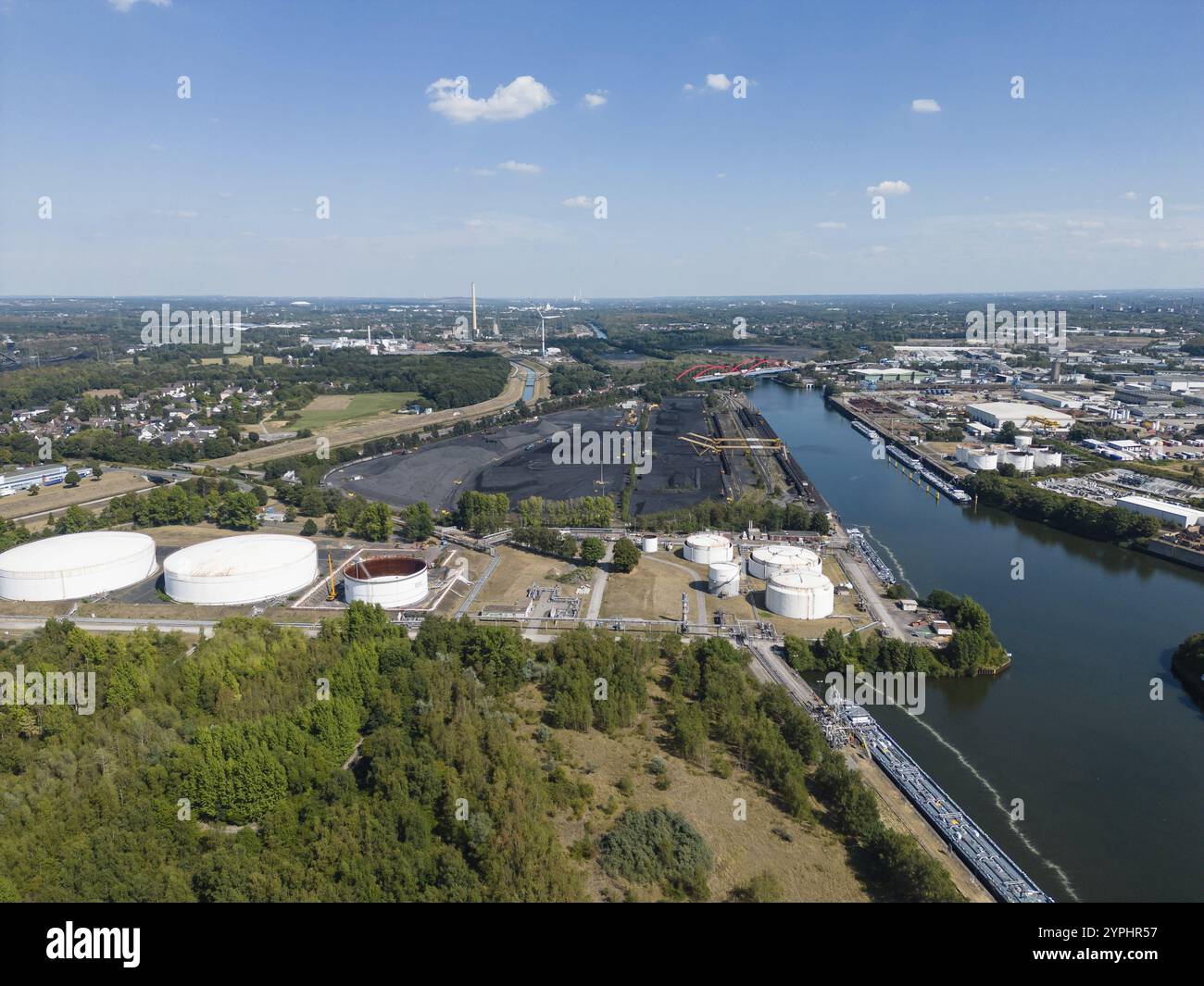 Aerial view of a port with coal storage, fuel depots and of oil tanks ...