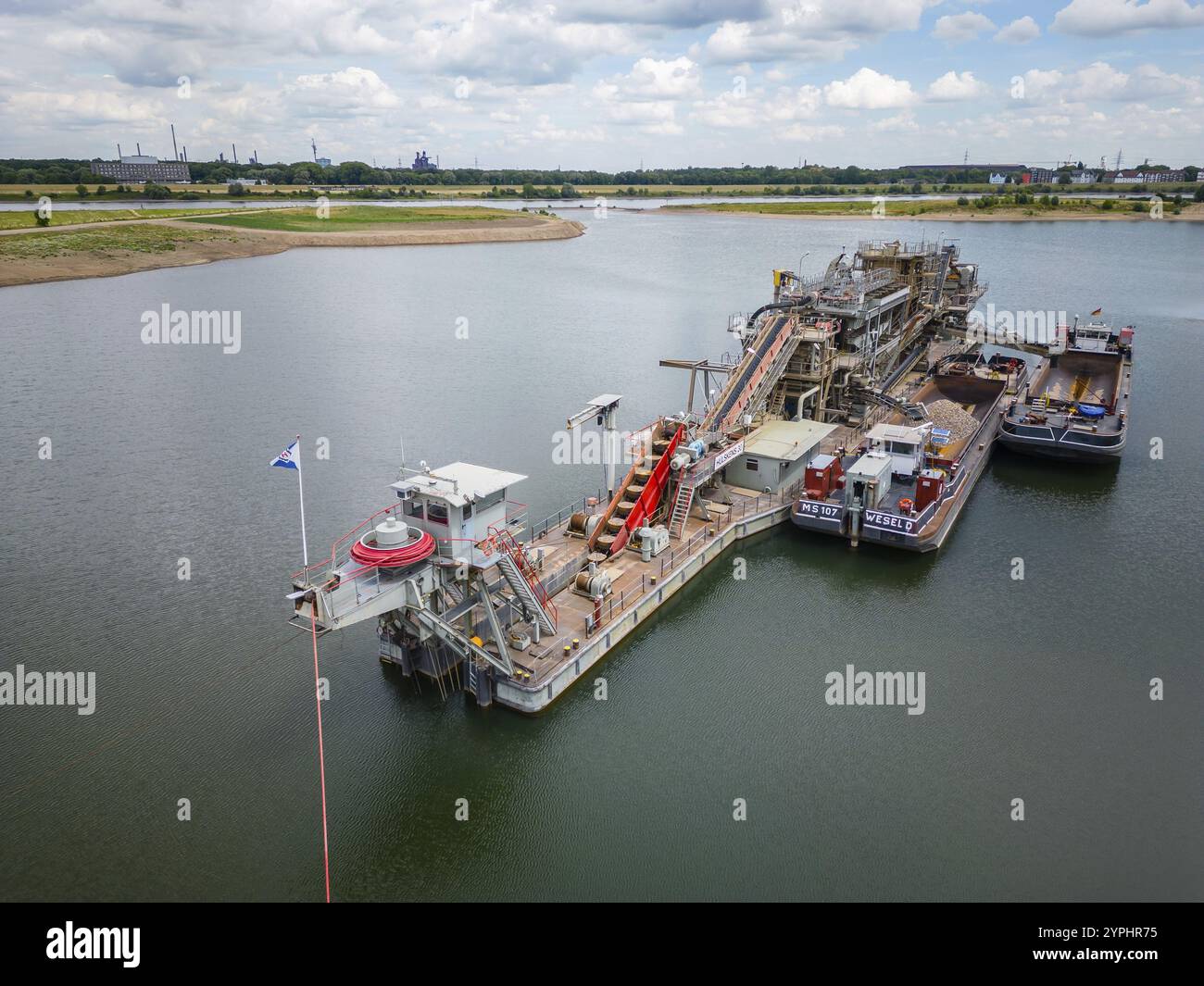 Gravel and sand extraction at the river Rhine using a gravel extractor ...