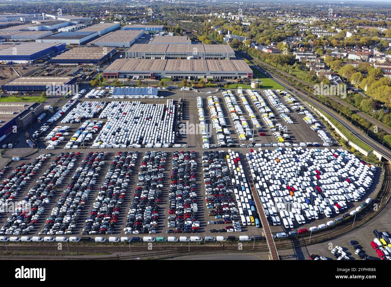Car terminal in a port on the Rhine river. Vehicles are stored, loaded ...