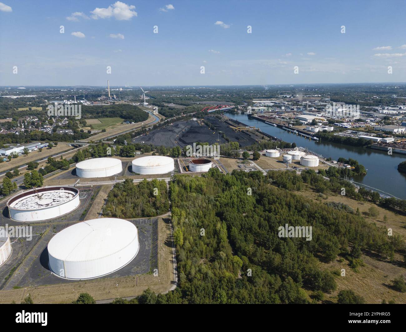 Aerial view of a port with coal storage, fuel depots and of oil tanks ...