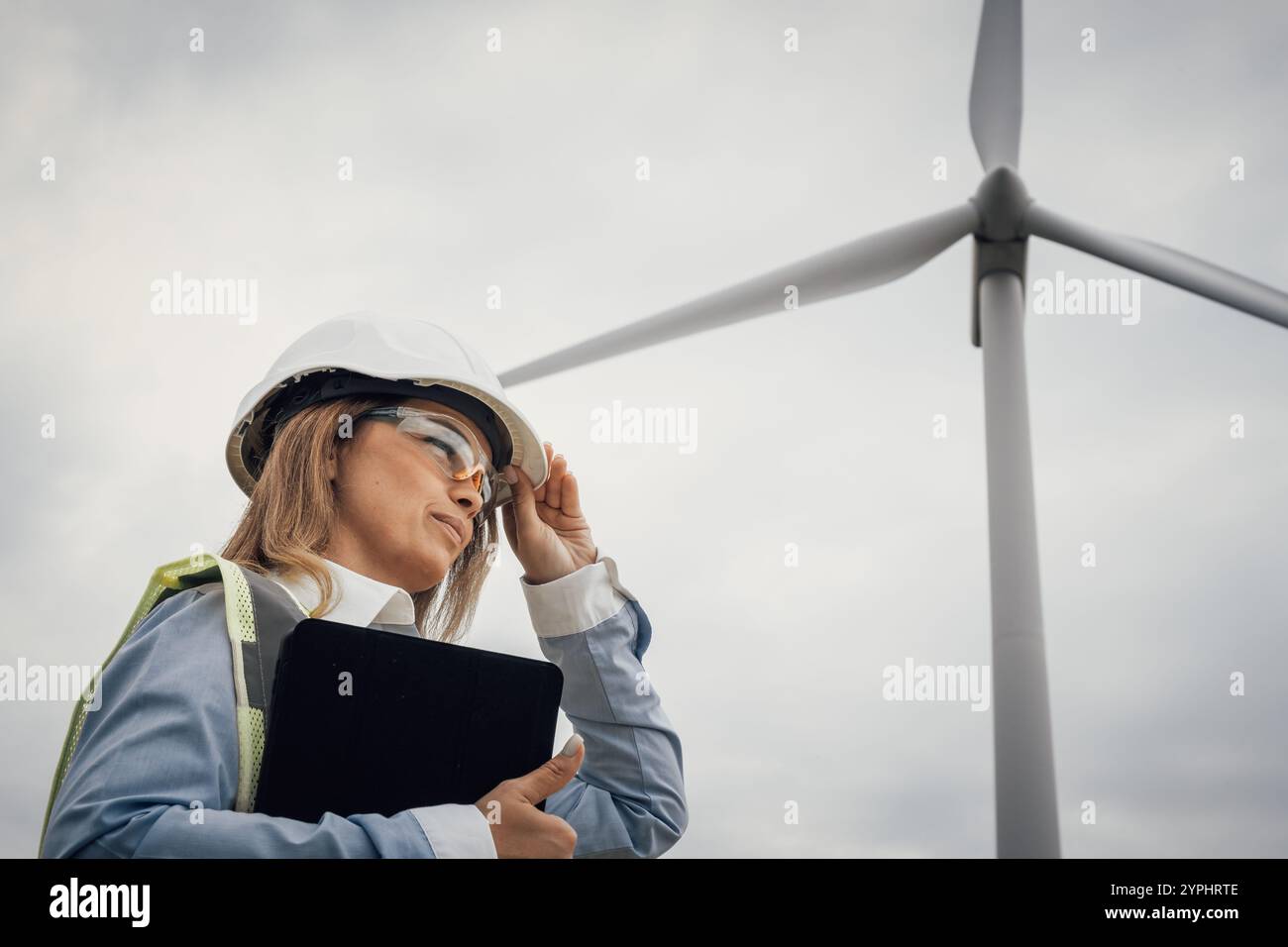 A dedicated female engineer is meticulously evaluating the performance ...