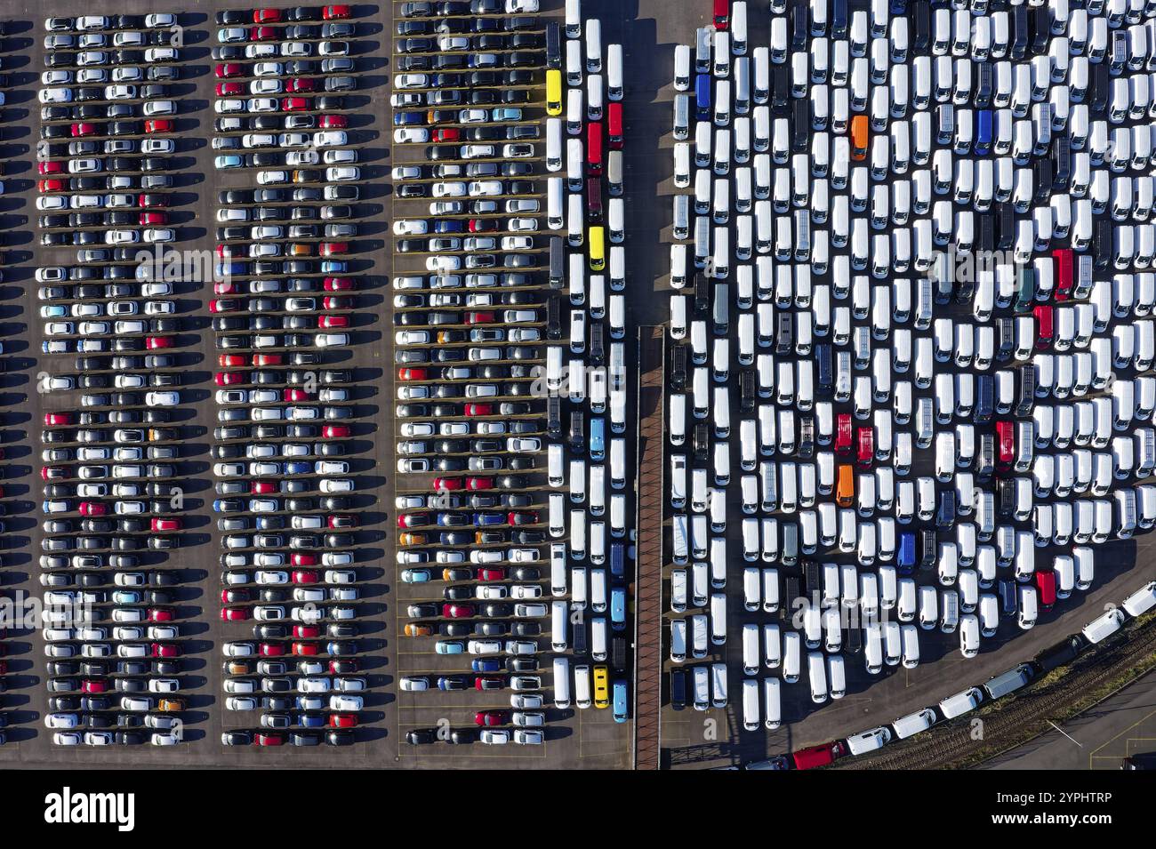 Car terminal in a port on the Rhine river. Vehicles are stored, loaded ...