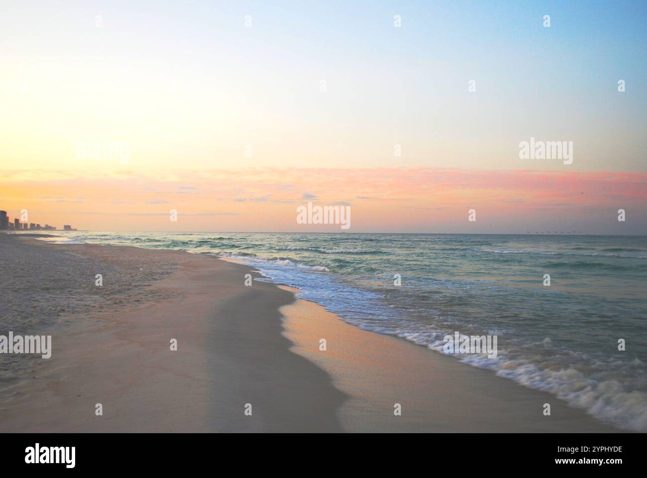 Colorful beach scene with waves and sand Stock Photo - Alamy