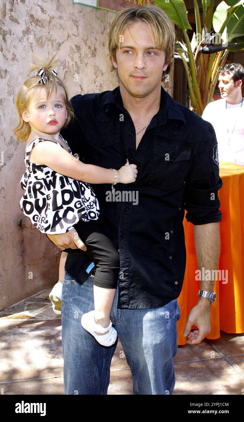 Larry Birkhead and daughter Dannielynn at the Simpsons Ride Opening ...