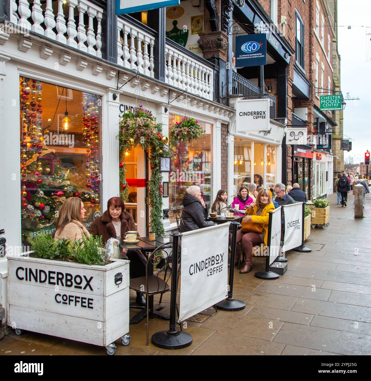 People sitting outdoors outside eating and drinking at pavement cafes ...