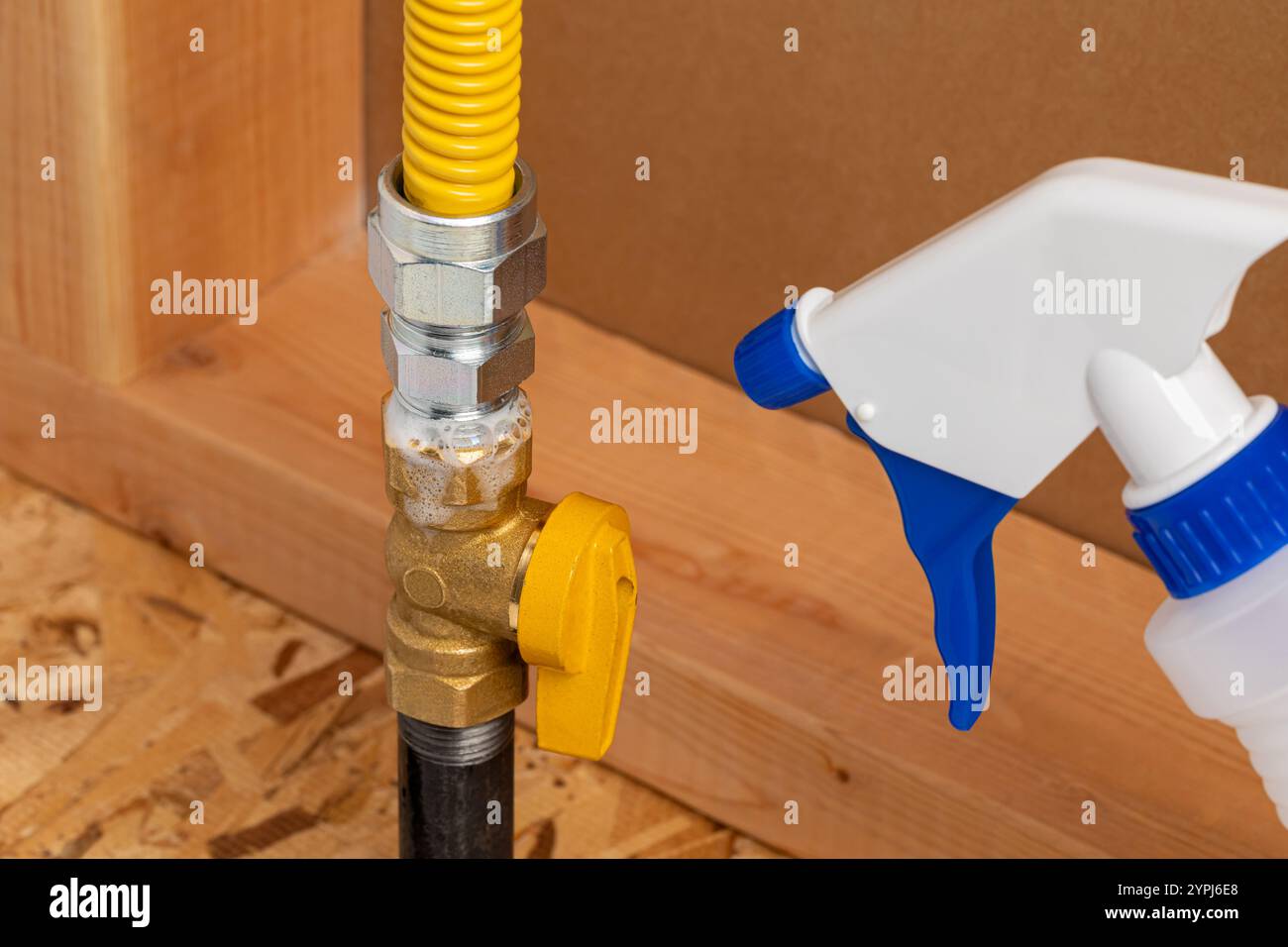 Checking natural gas fitting with soapy water. Plumbing, gas leak ...