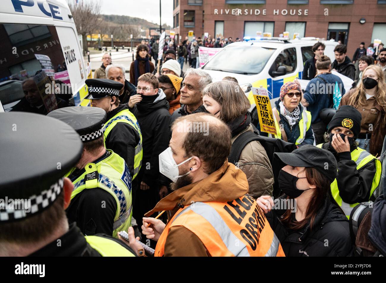A group of counter-protestors surrounded a police vehicle after one of ...