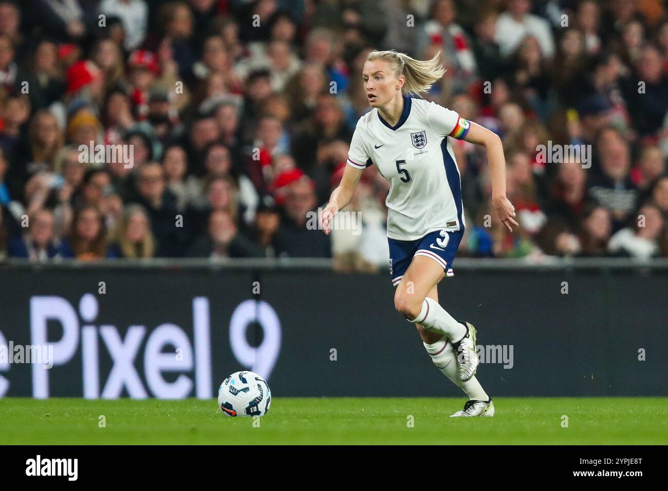 Leah Williamson of England runs with the ball during the Women's ...