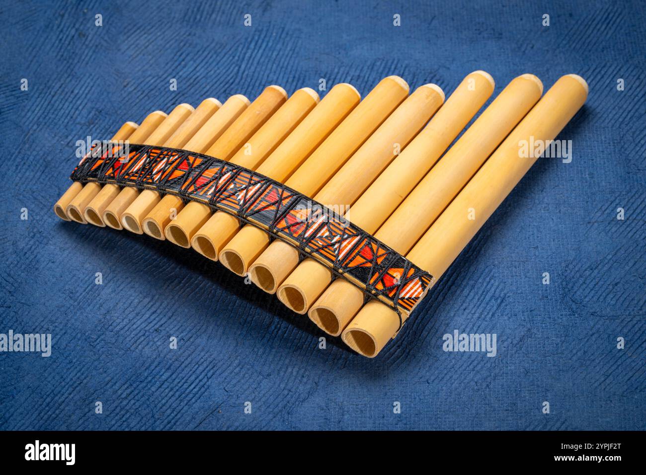 bamboo pan flute instrument from Peru against textured art paper Stock ...