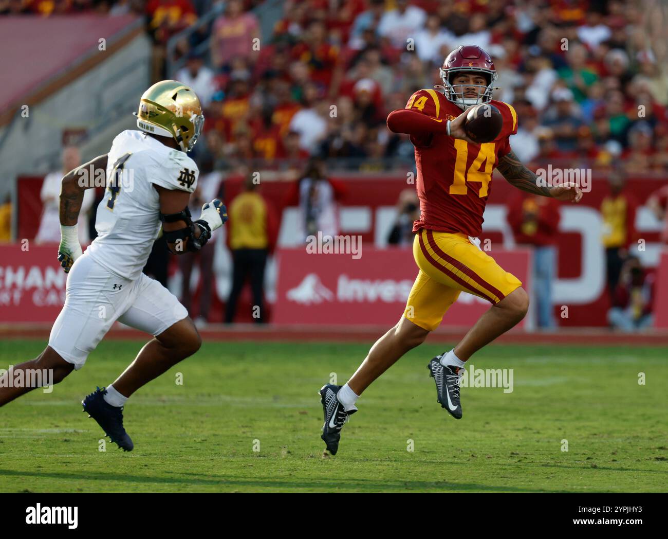 November 30, 2024 USC Trojans quarterback Jayden Maiava (14) scrambles ...