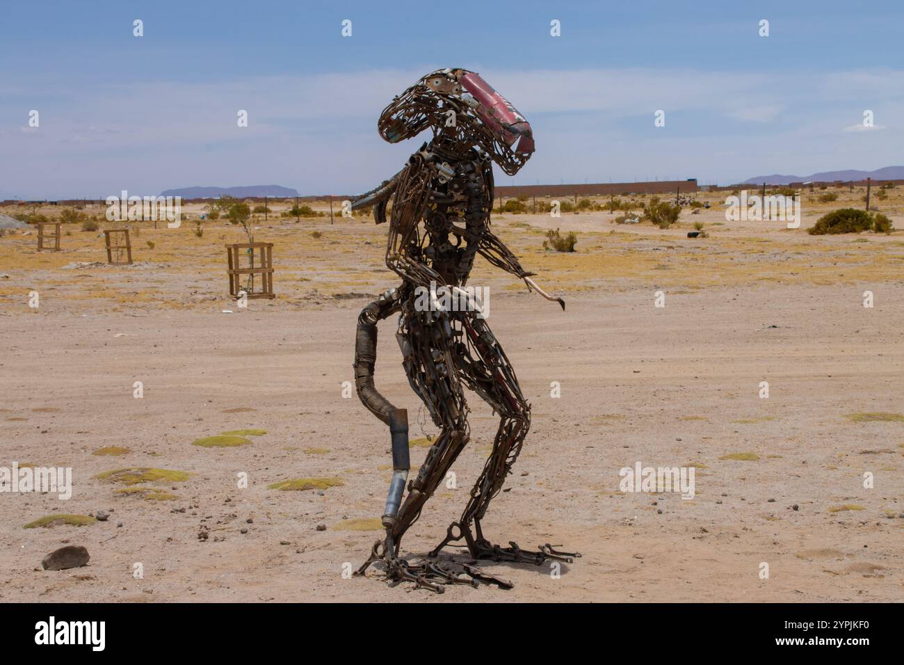 A sculpture made of recycled metal depicting an alien-like creature in ...