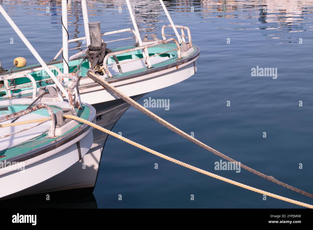 Front bow of two moored Japanese fishing boats Stock Photo - Alamy