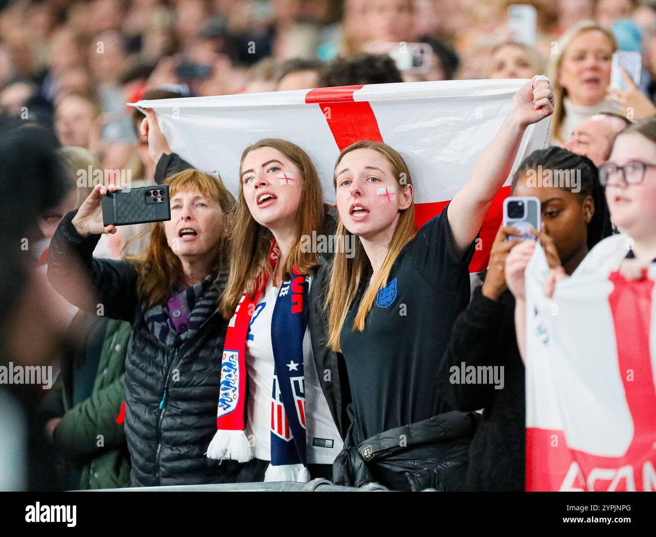 Wembley Stadium, UK. 30th Nov, 2024. Fan sining the National Anthem for ...
