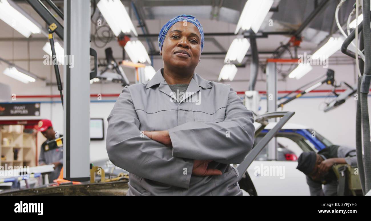Female mechanic crossing arms in hi-res stock photography and images ...