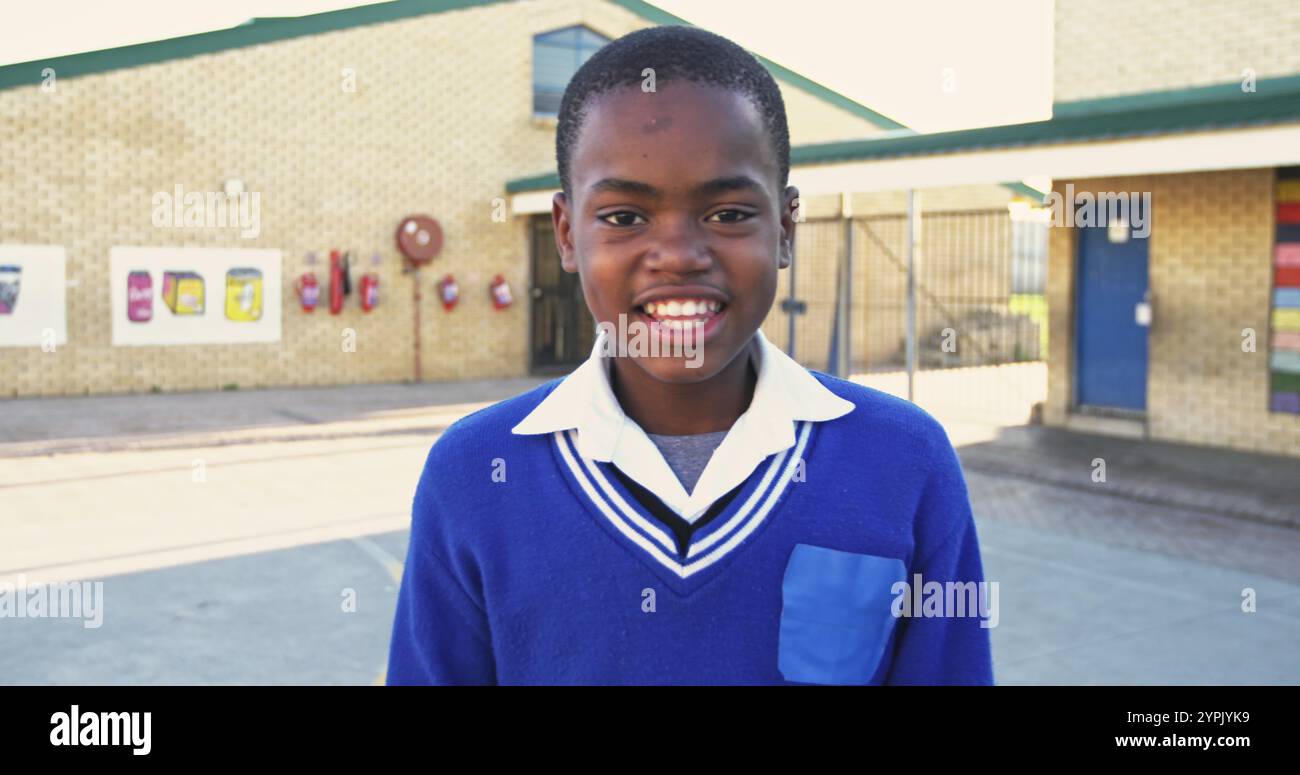 Portrait close up of a young African schoolboy wearing his school ...