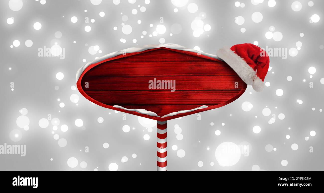 Image of red sign with santa hat spots of light falling on grey ...