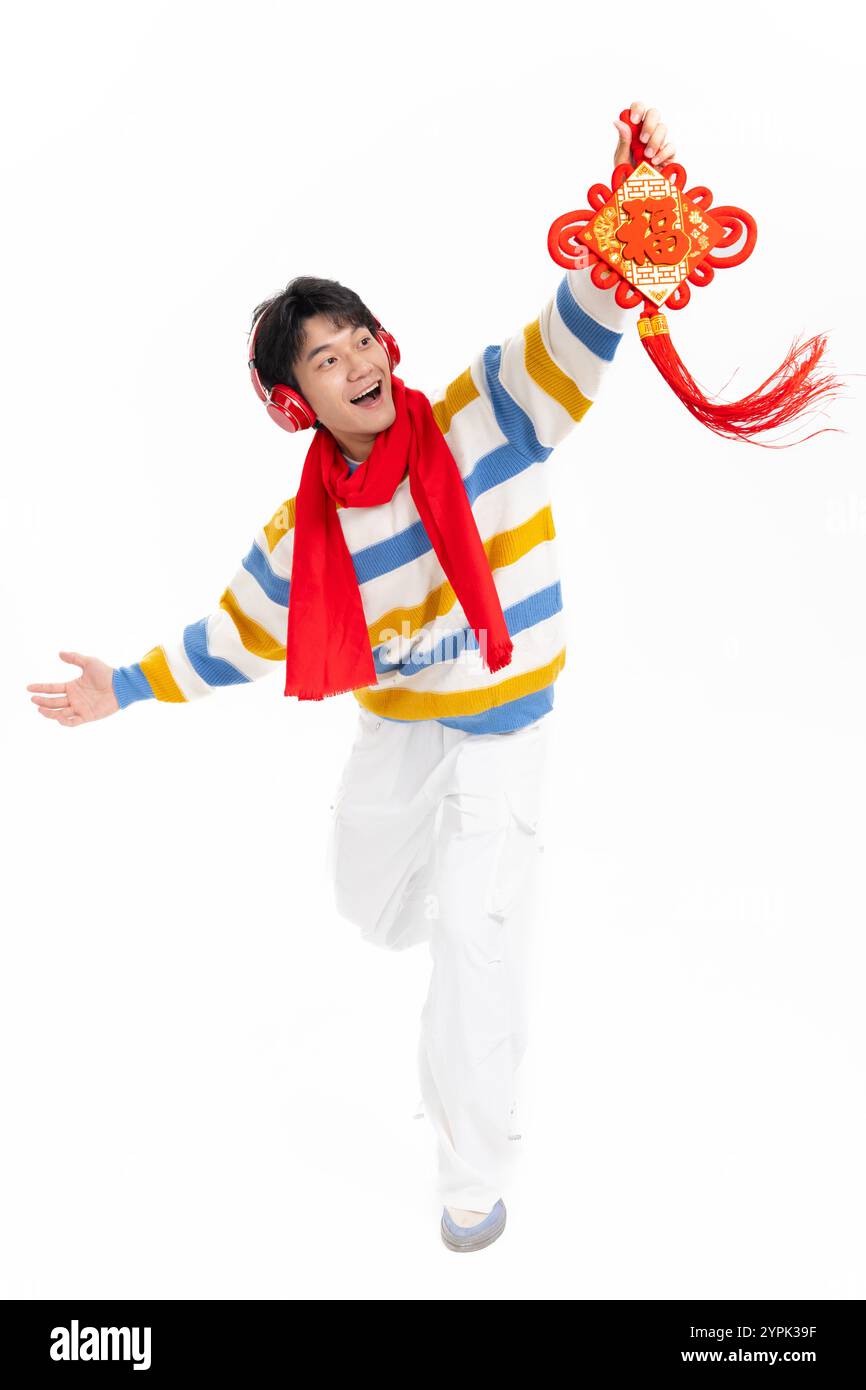 Young Asian man running with FU pendant in hand Stock Photo - Alamy