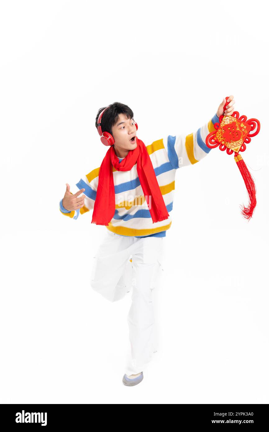 Young Asian man running with FU pendant in hand Stock Photo - Alamy