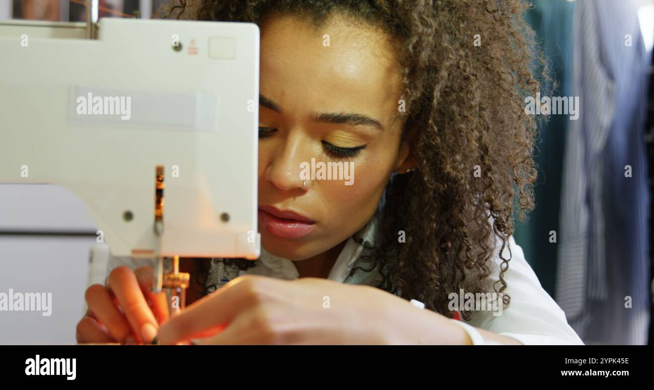 Front view of African American female fashion designer working with ...