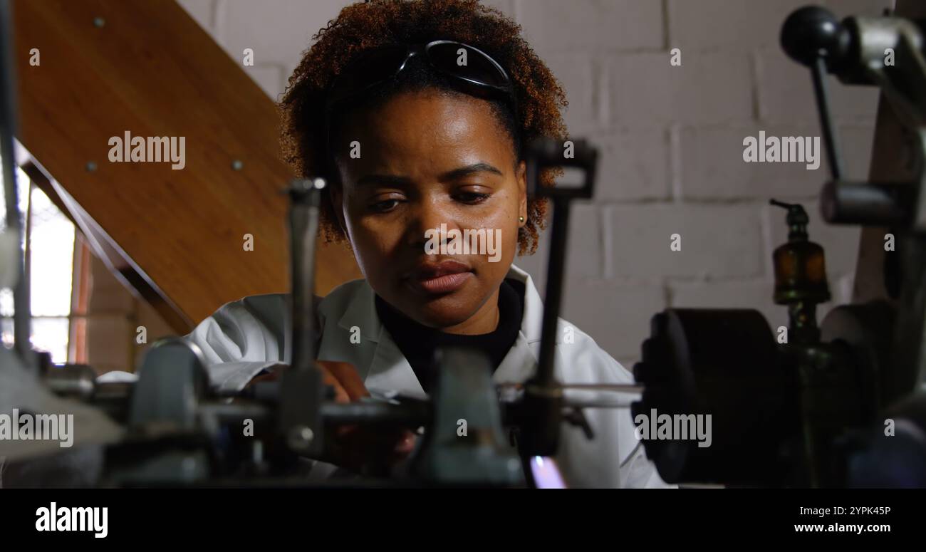 Female worker measuring glass size in glass factory. Worker using ...