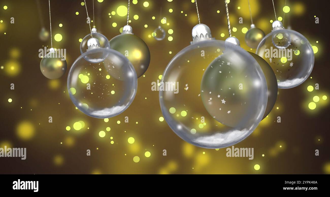 Image of glass baubles over snow falling on yellow background Stock ...