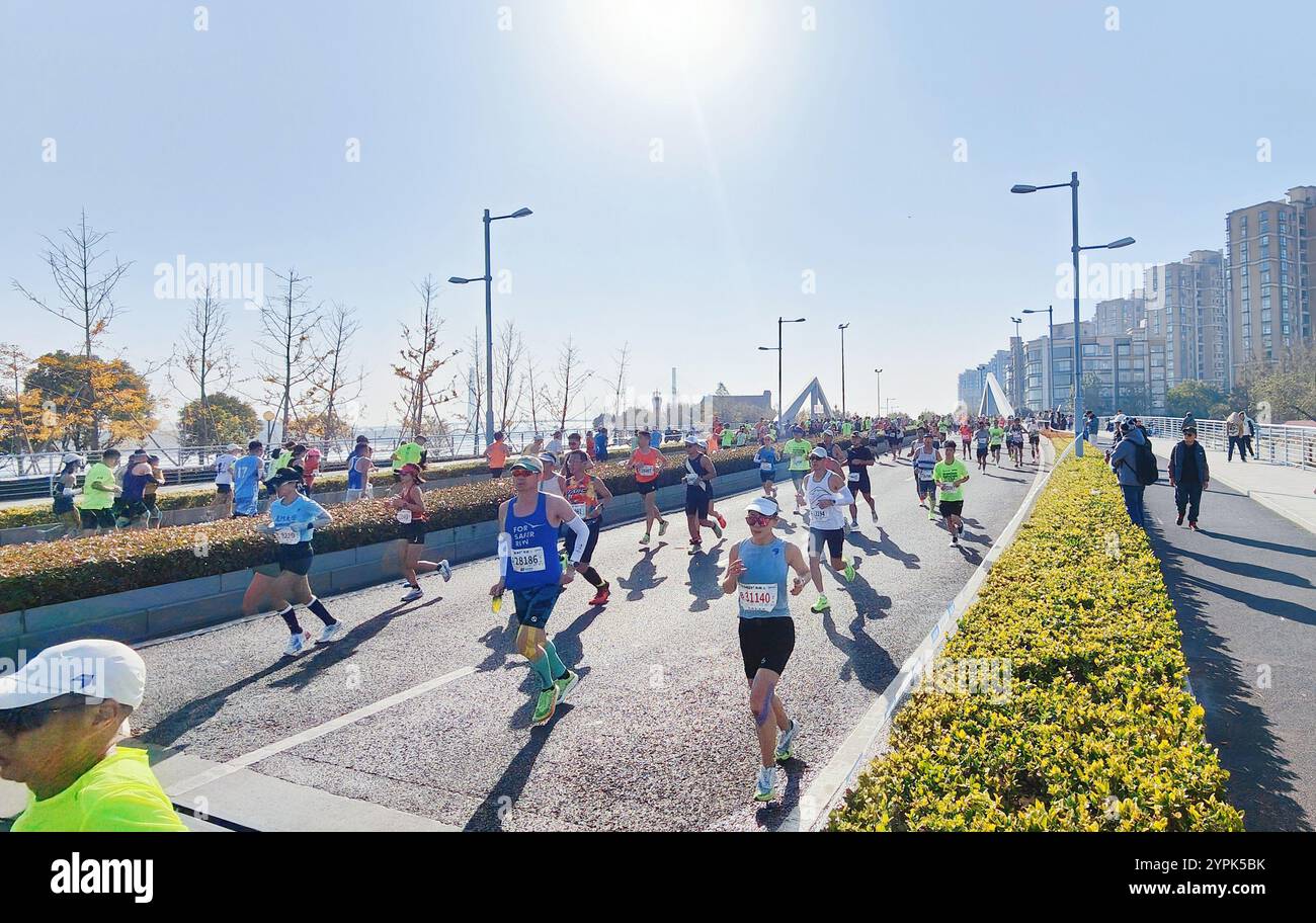 SHANGHAI, CHINA - DECEMBER 1, 2024 - Runners take part in the Shanghai ...