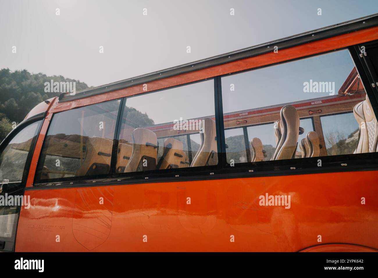Orange Bus with Empty Seats Stock Photo - Alamy