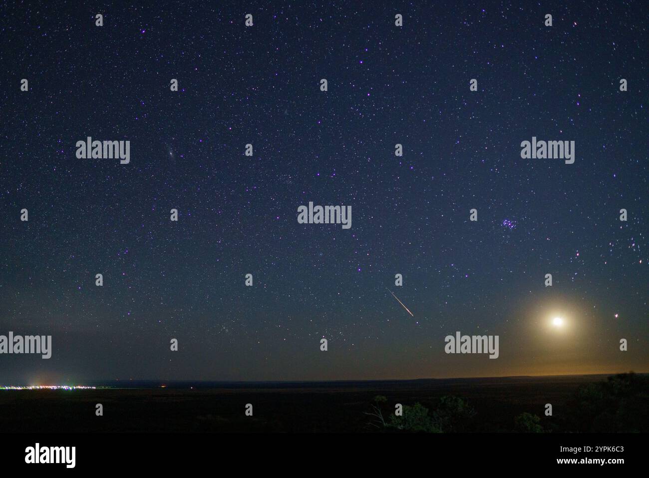 The Starlit Night Sky showcases a vibrant Meteor and a glowing Moon ...