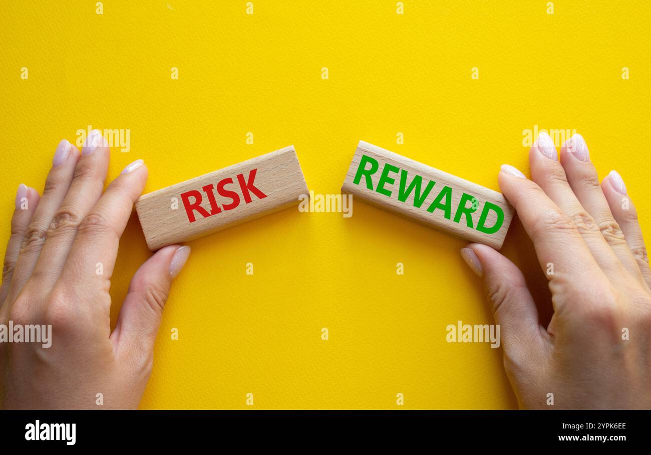 Risk or Reward symbol. Concept word Risk or Reward on wooden blocks ...