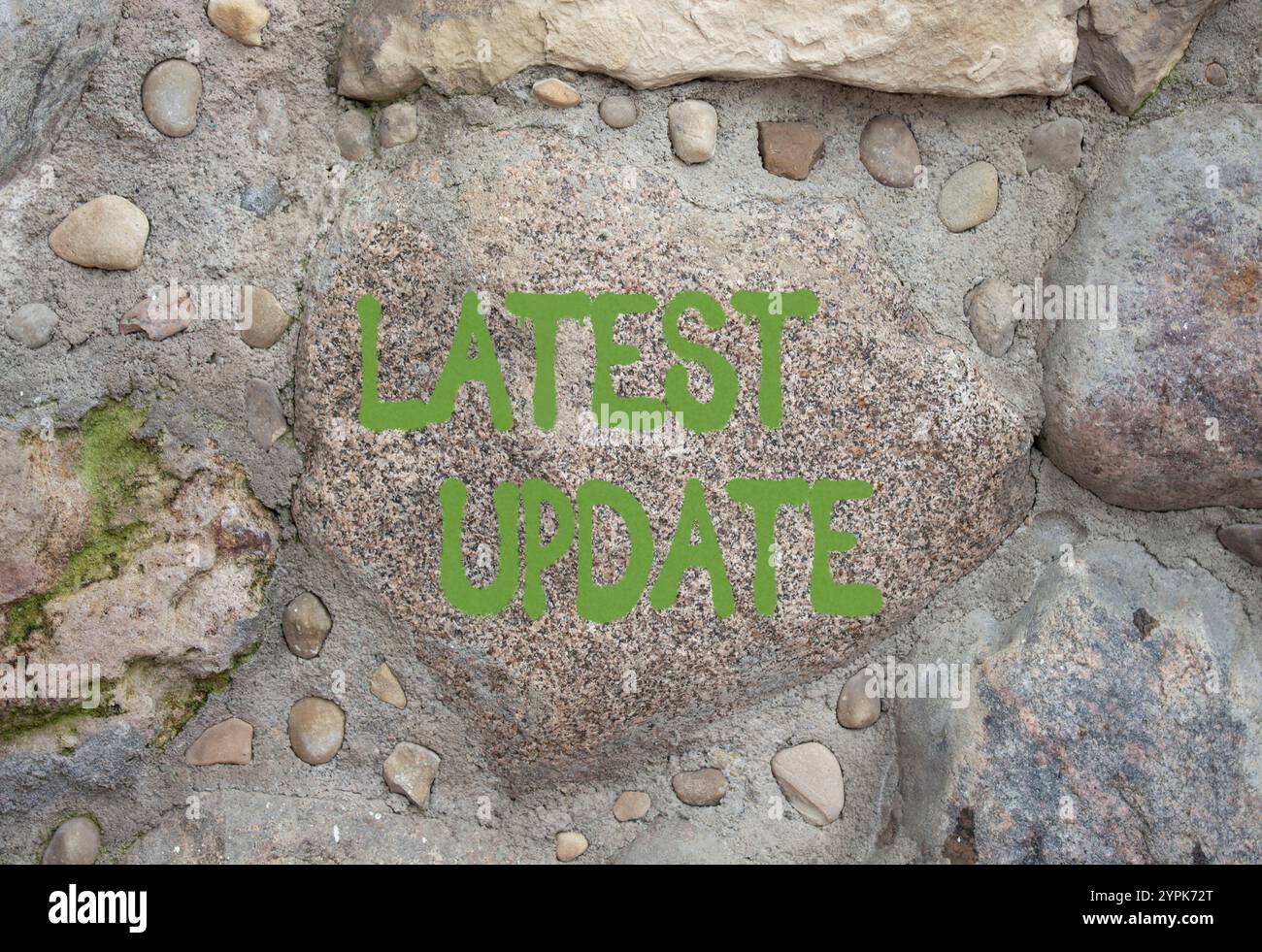 Latest update symbol. Stone wall with words Latest update. Beautiful ...